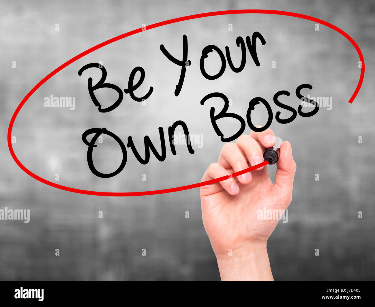 Man Hand writing Be Your Own Boss with black marker on visual screen ...