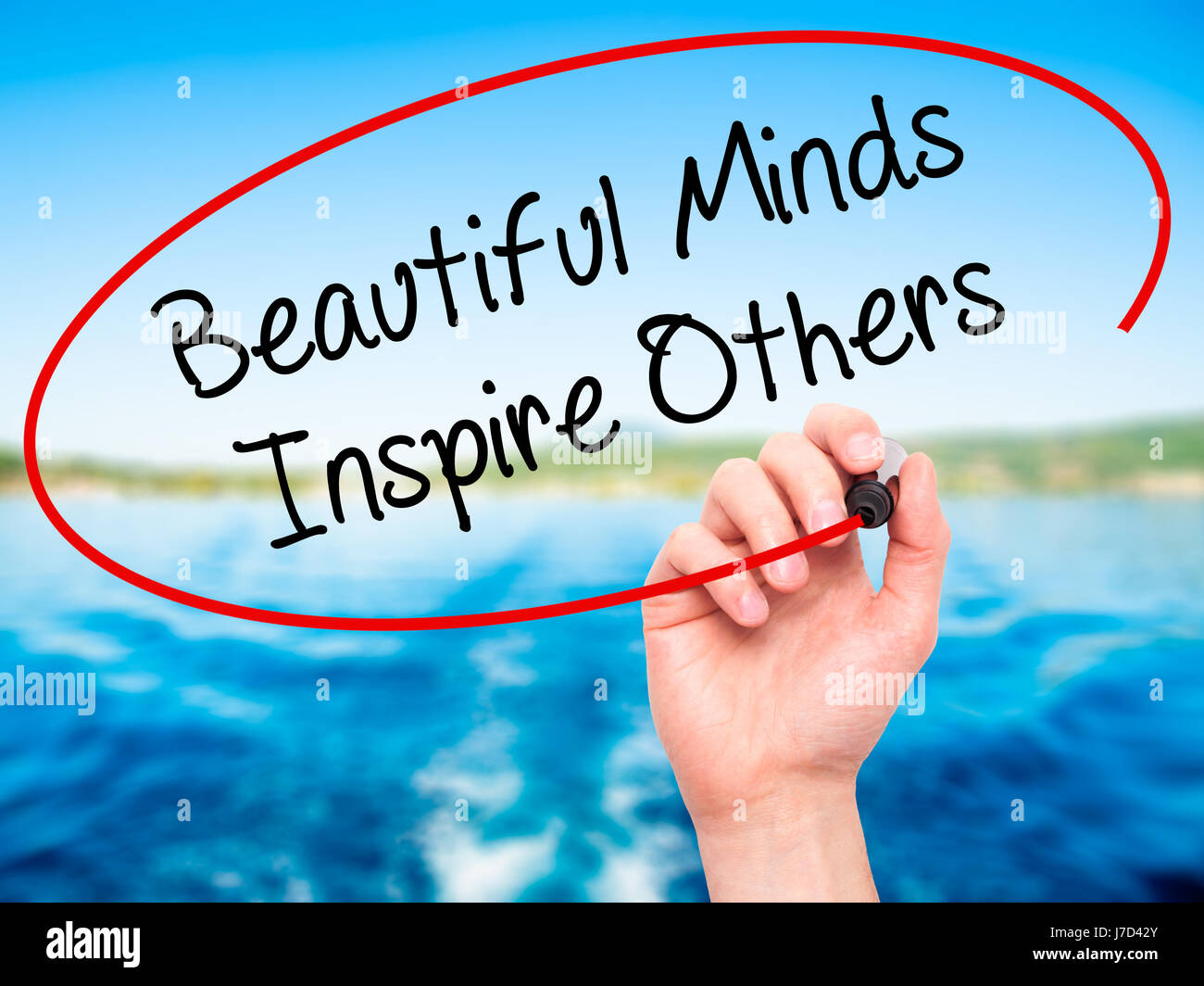 Man Hand writing Beautiful Minds Inspire Others with black marker on ...