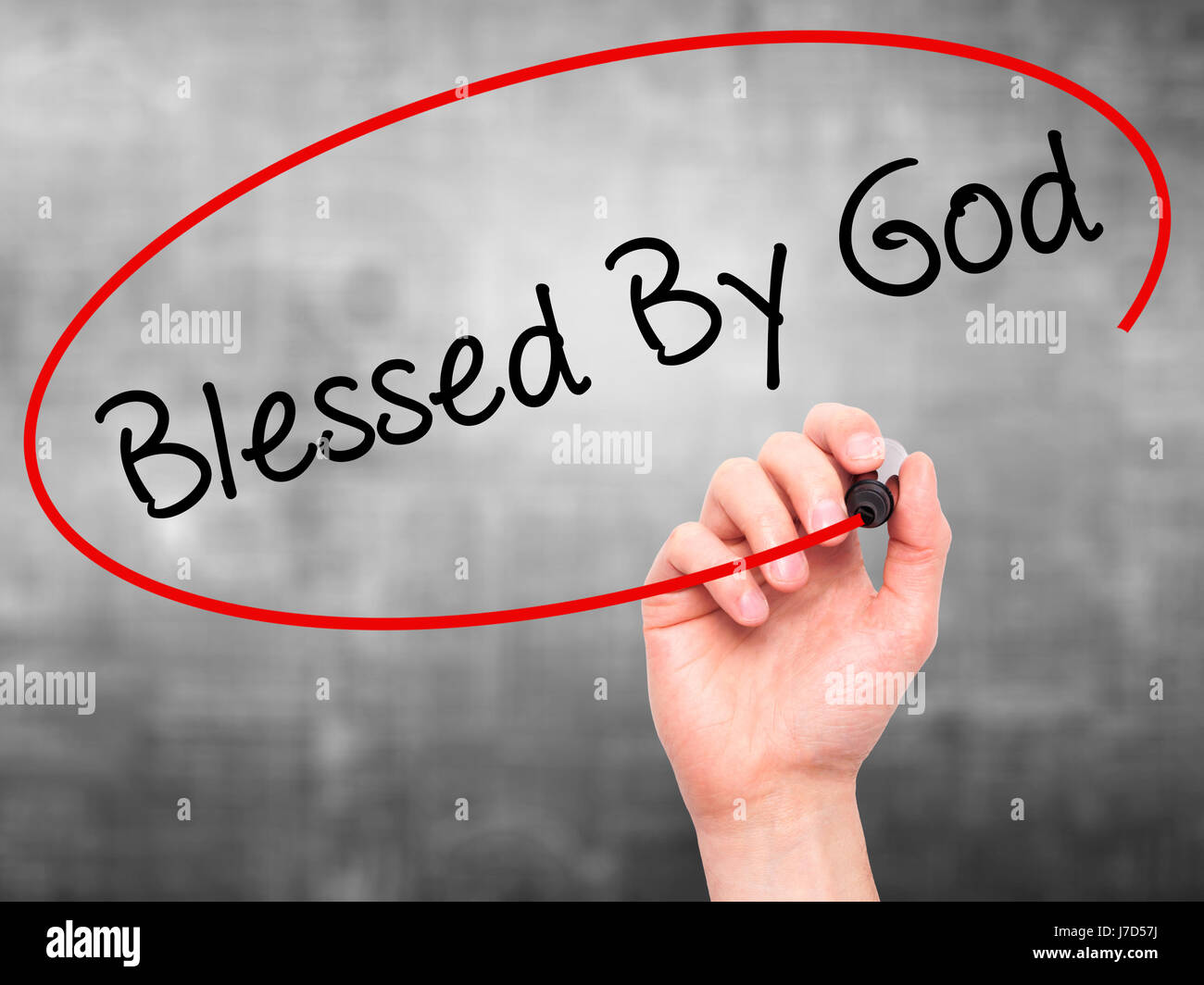 Man Hand writing Blessed By God with black marker on visual screen ...