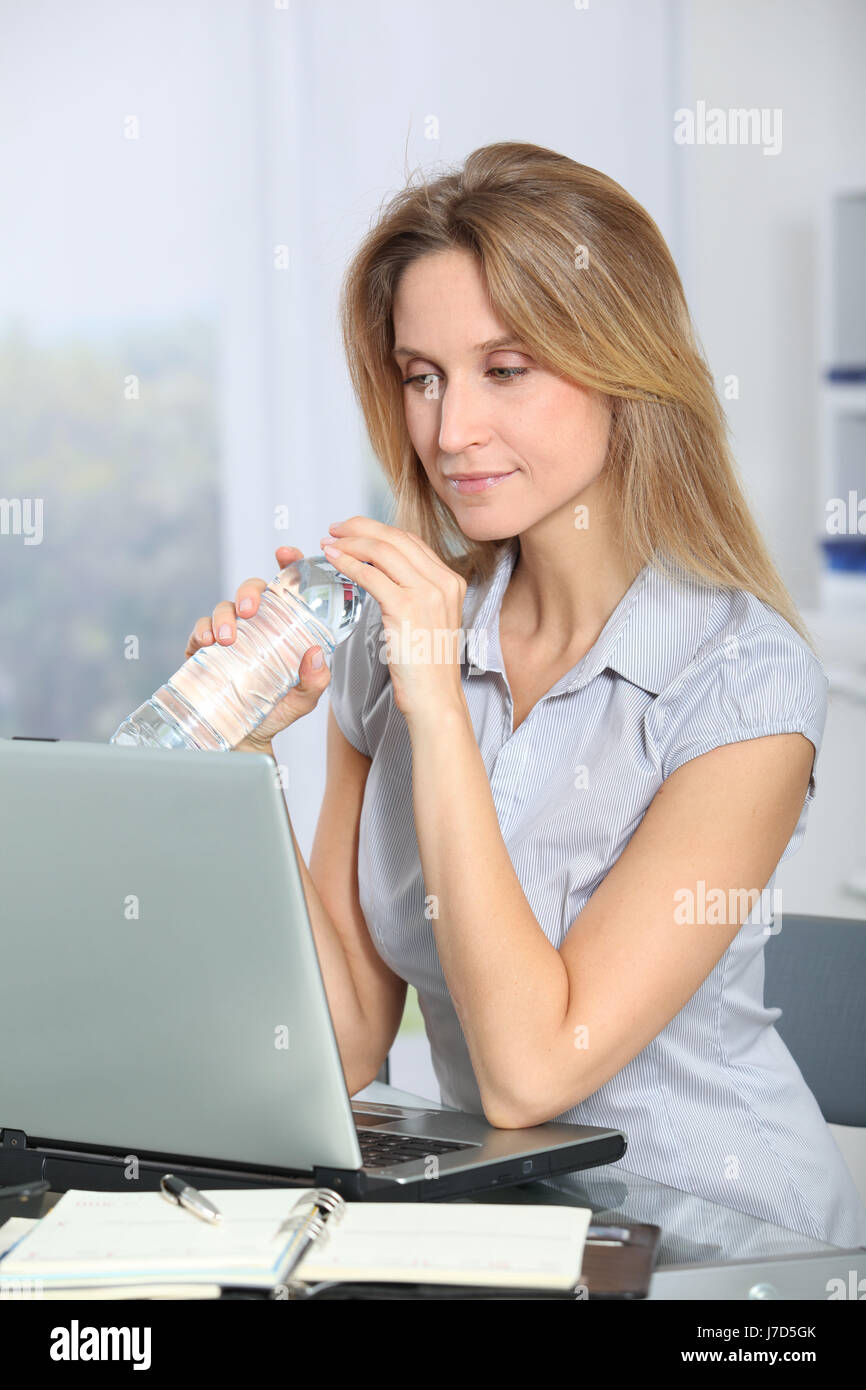 woman office laptop notebook computers computer laugh laughs laughing ...