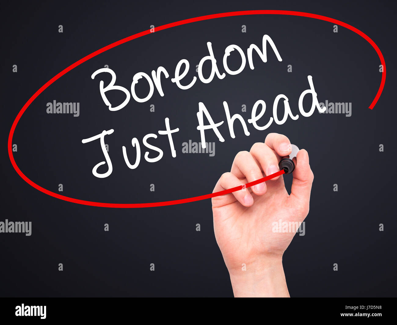 Man Hand writing Boredom Just Ahead with black marker on visual screen ...