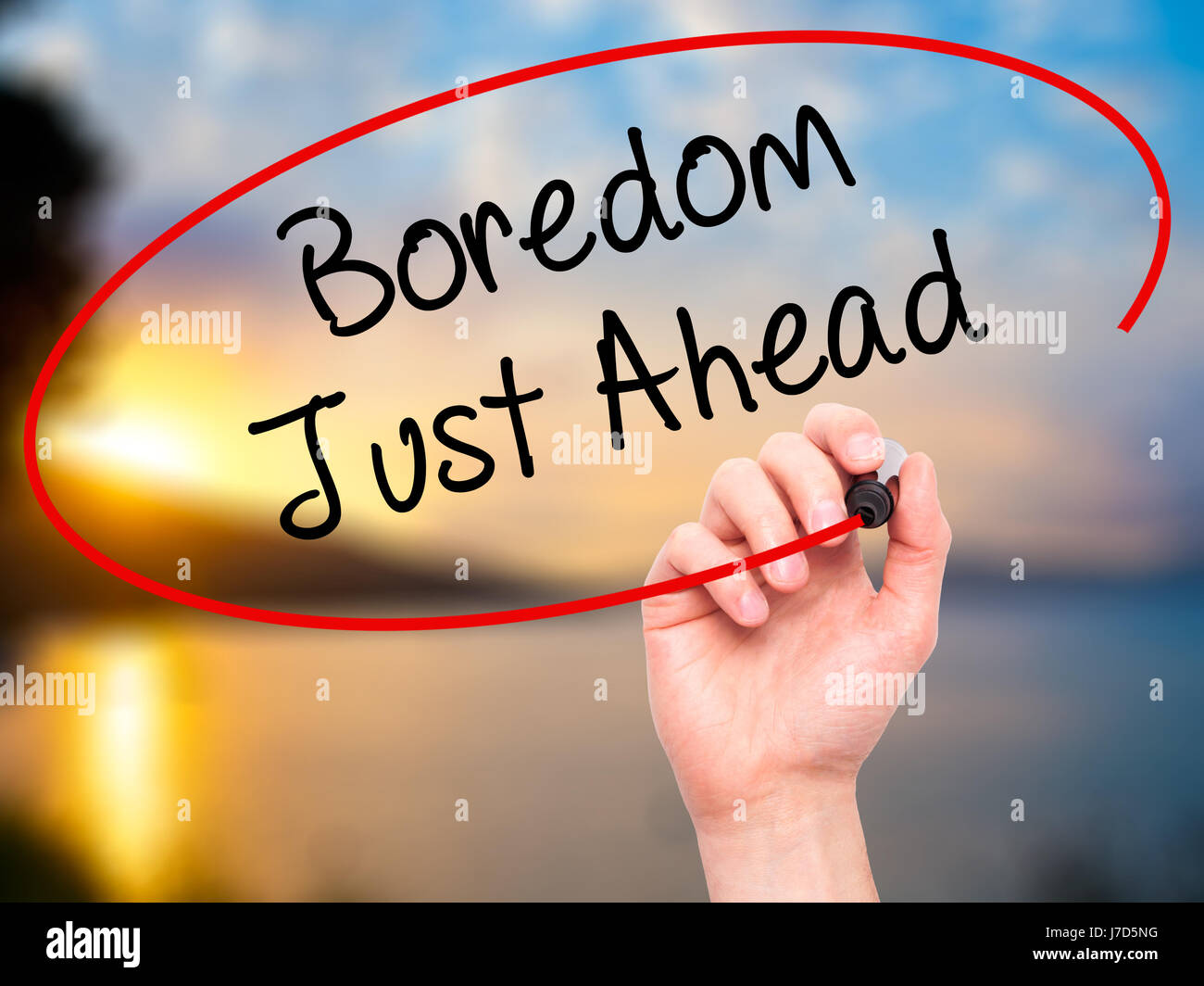 Man Hand writing Boredom Just Ahead with black marker on visual screen ...