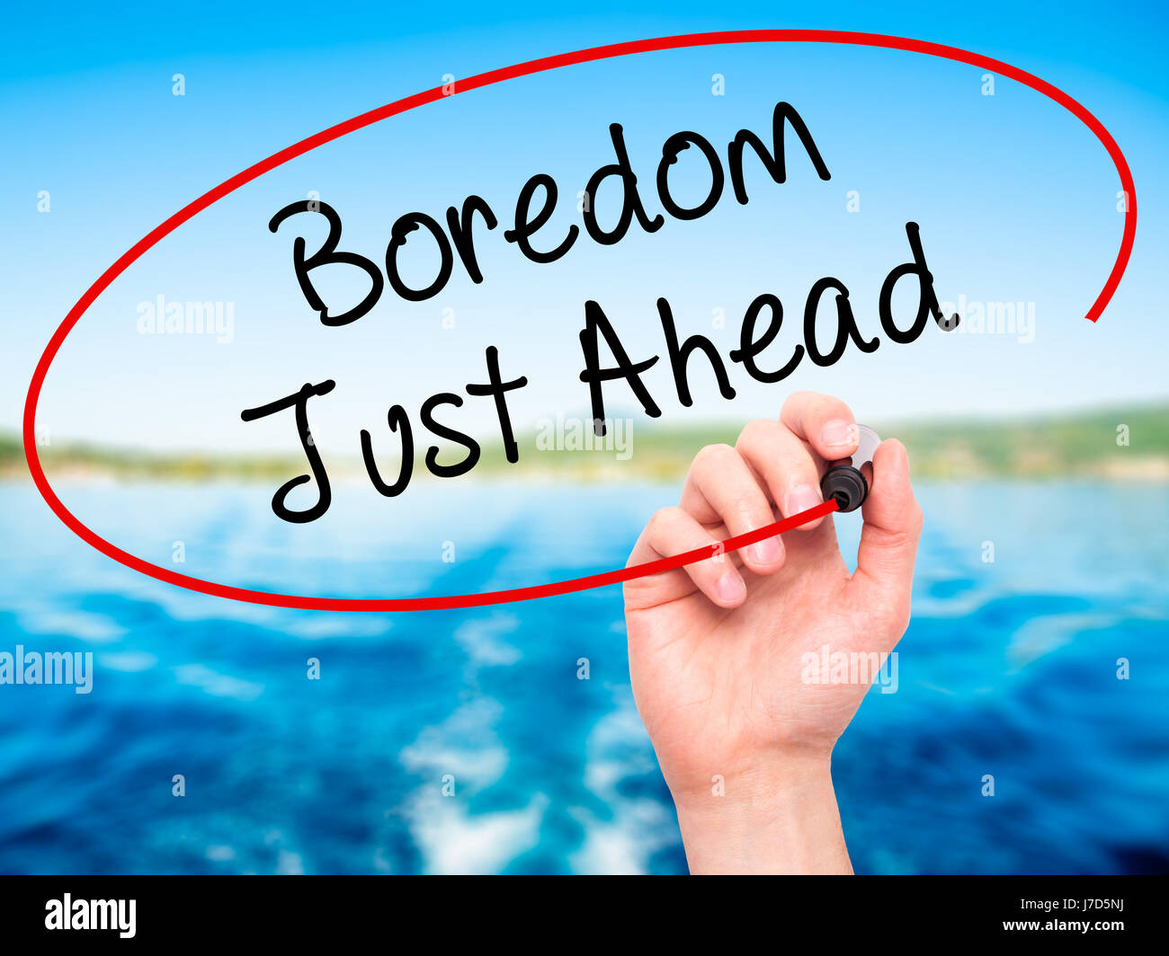 Man Hand writing Boredom Just Ahead with black marker on visual screen ...