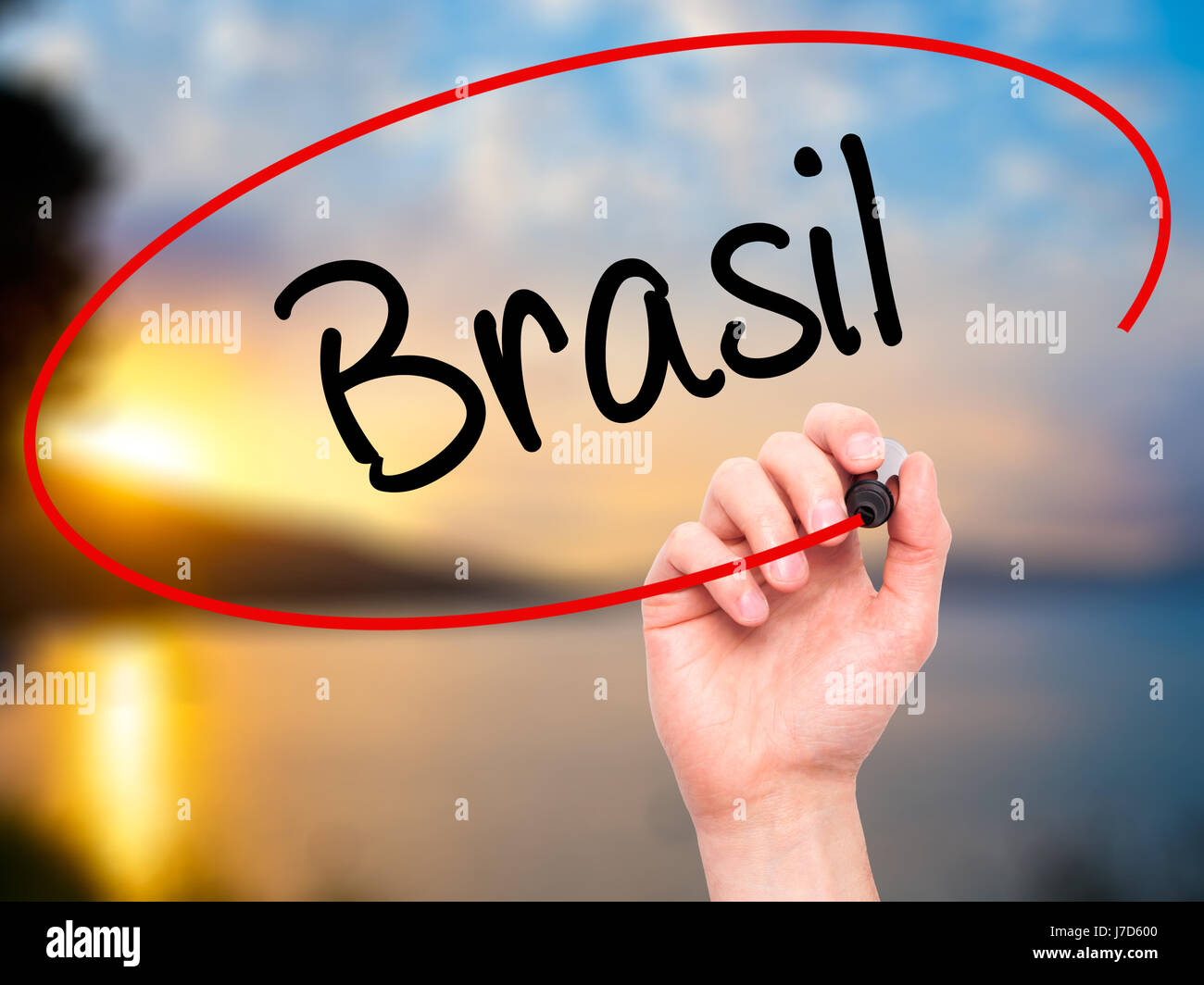 Man Hand writing Brasil ( Brazil in Portuguese) with black marker on ...