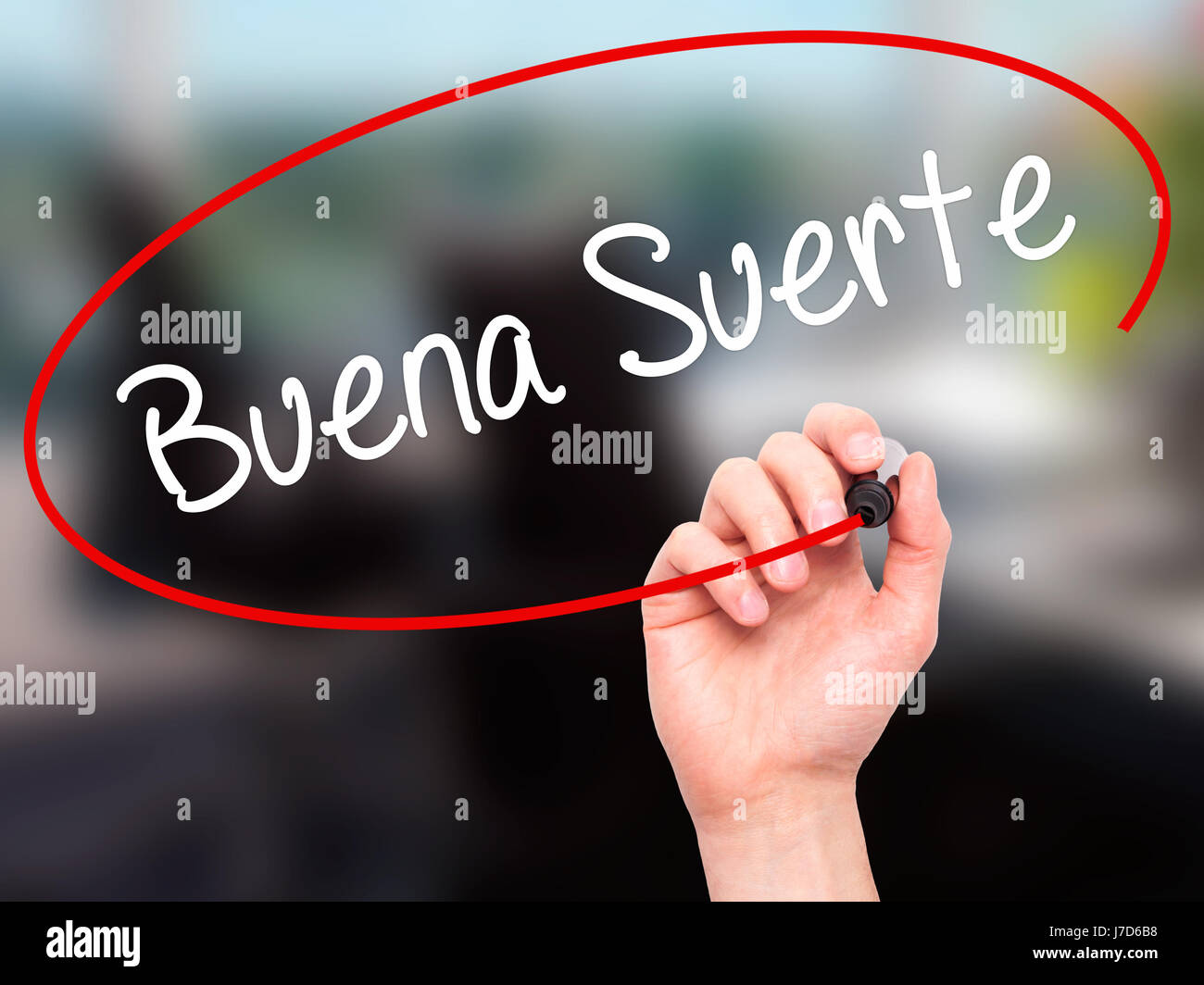 Man Hand writing Buena Suerte( Good Luck in Spanish) with black marker ...