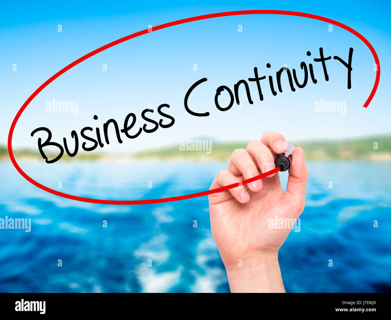 Man Hand writing Business Continuity with black marker on visual screen ...