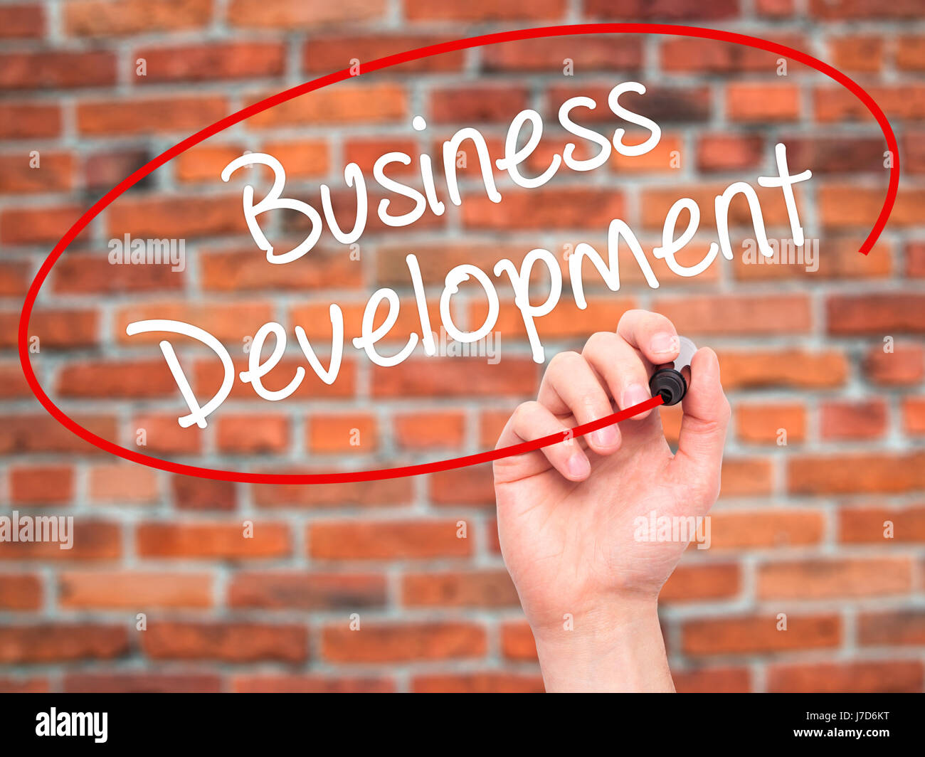 Man Hand writing Business Development with black marker on visual ...