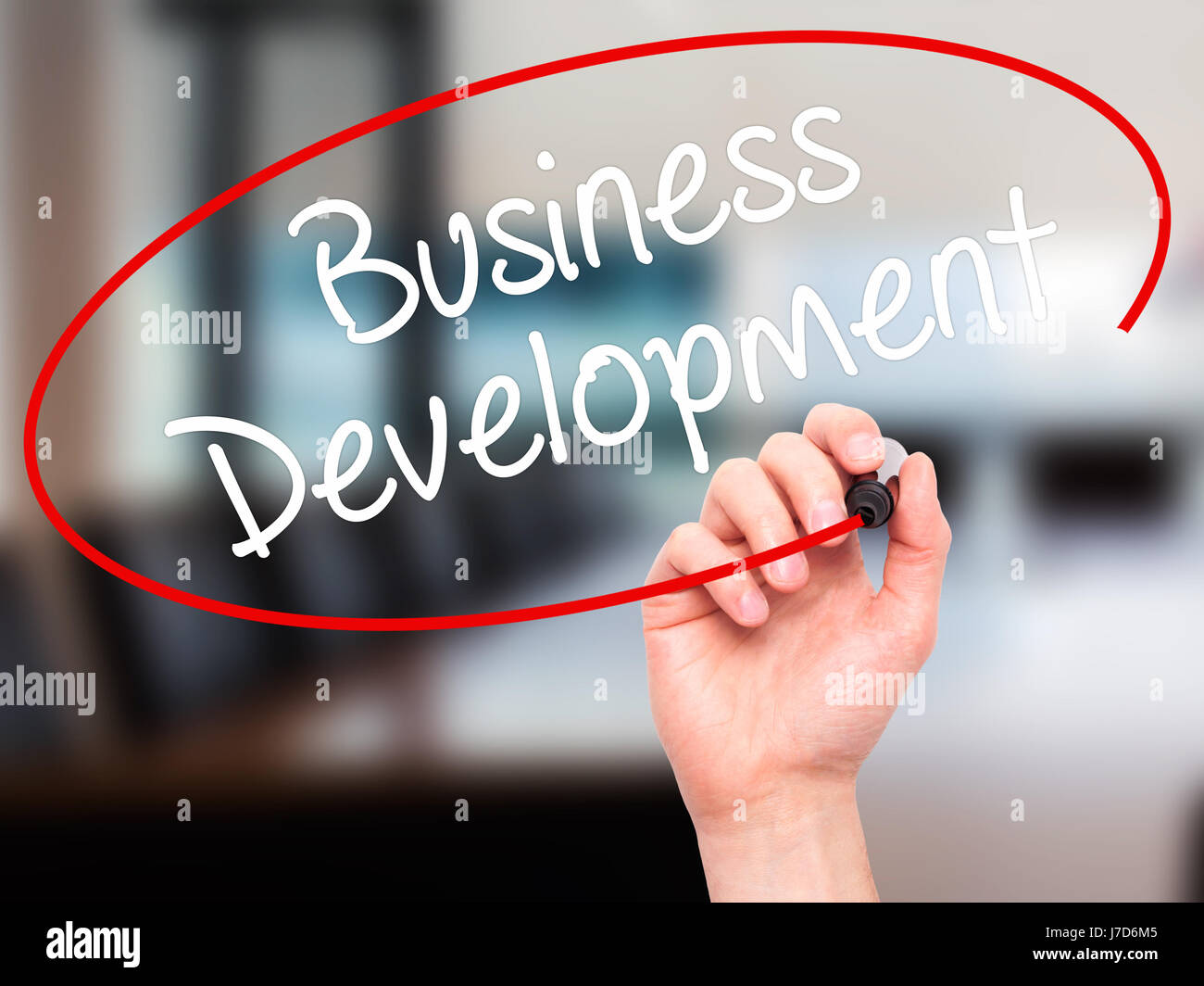 Man Hand writing Business Development with black marker on visual ...