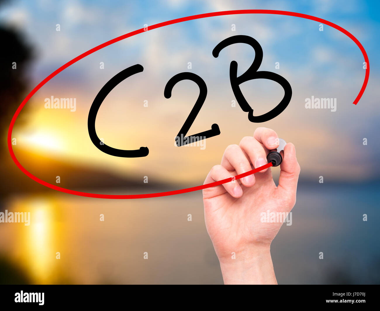 Man Hand writing C2B with black marker on visual screen. Isolated on background. Business ...