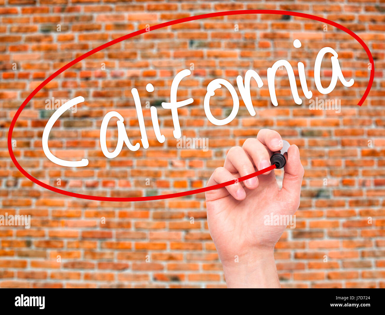 Man Hand writing California with black marker on visual screen ...