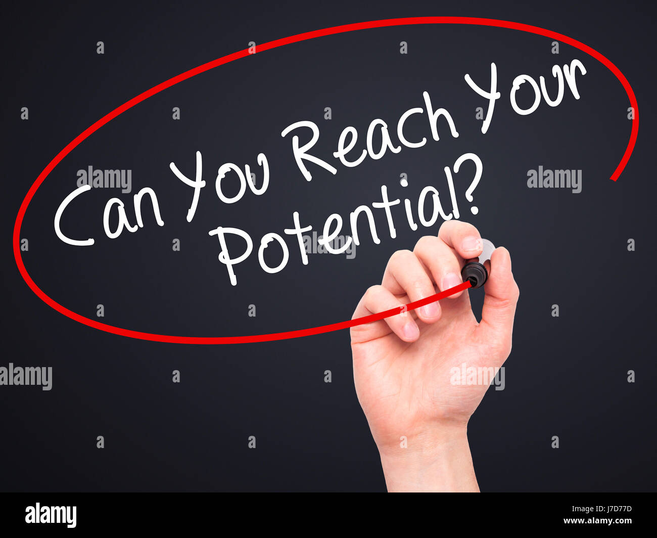 Man Hand writing Can You Reach Your Potential? with black marker on ...