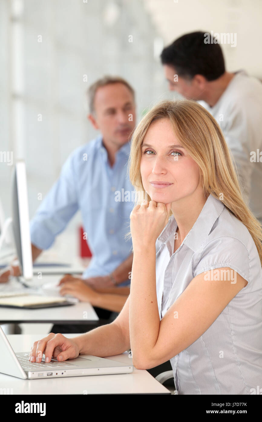 woman office laptop notebook computers computer laugh laughs laughing ...