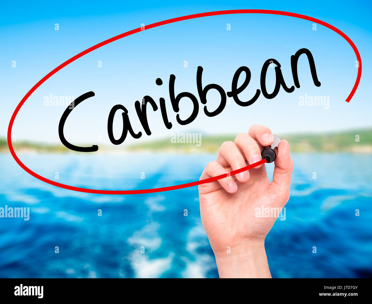 Man Hand writing Caribbean with black marker on visual screen. Isolated ...