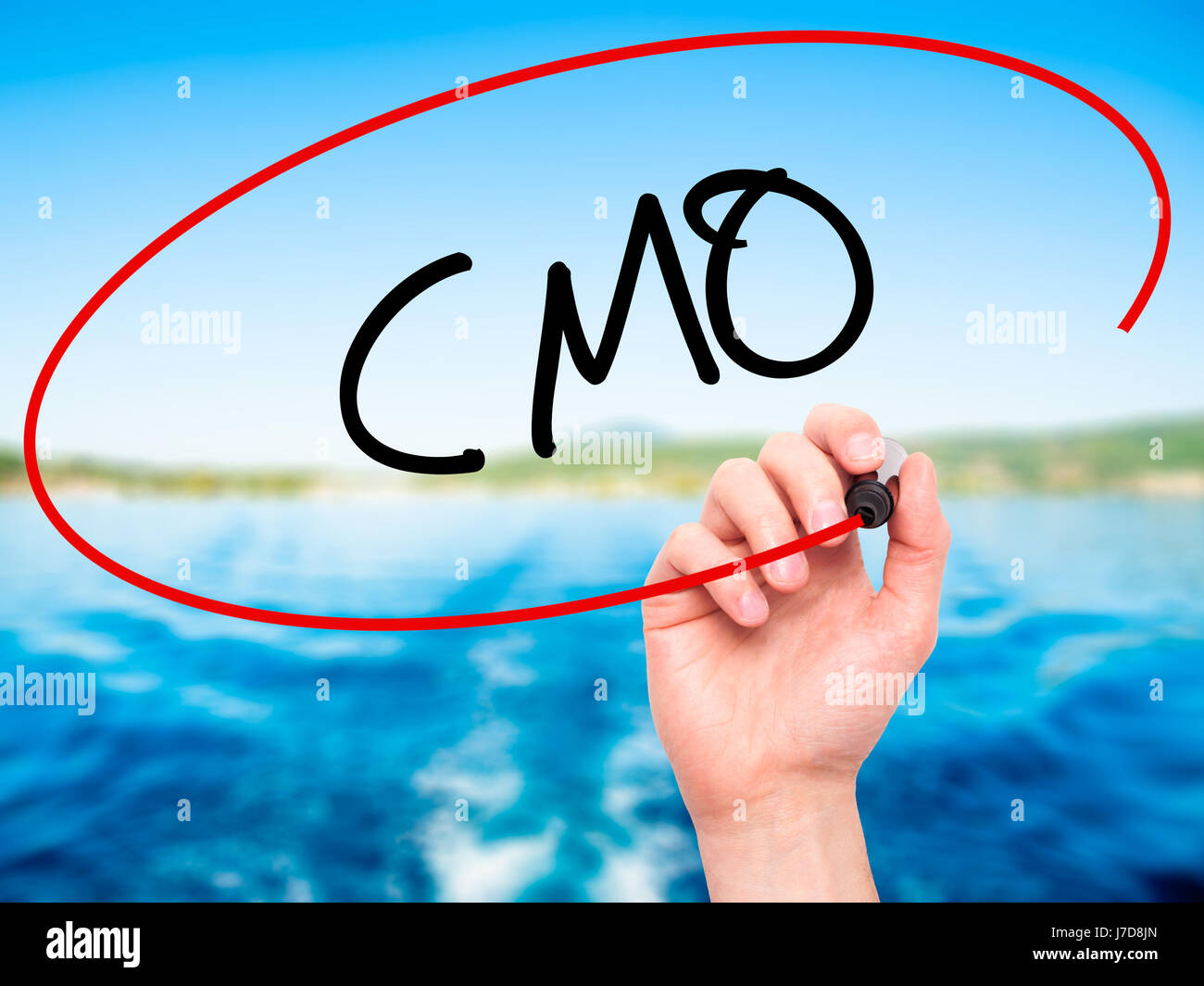 Man Hand writing CMO (Chief Marketing Officer) with black marker on ...