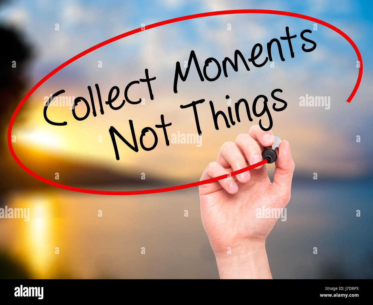 Man Hand writing Collect Moments Not Things with black marker on visual ...