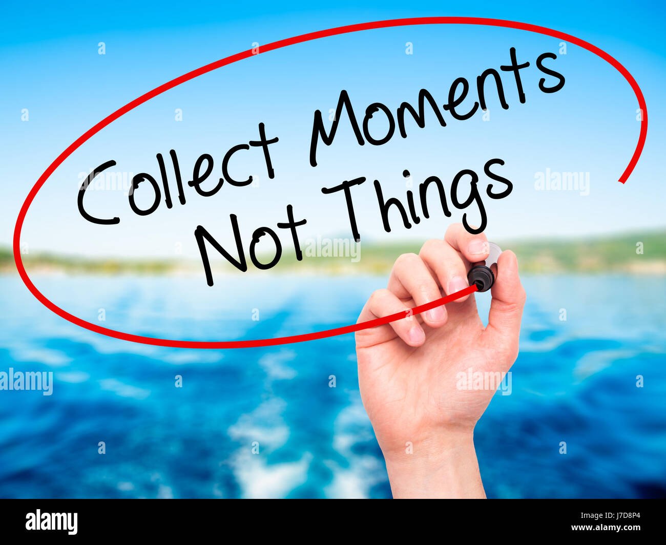 Man Hand writing Collect Moments Not Things with black marker on visual ...