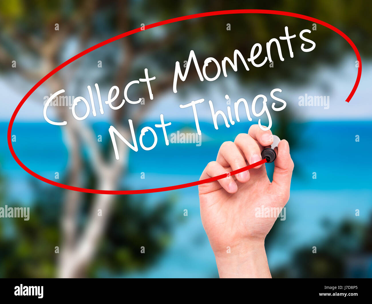 Man Hand writing Collect Moments Not Things with black marker on visual ...