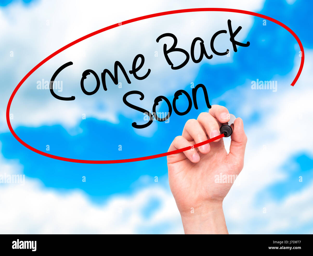 Man Hand writing Come Back Soon with black marker on visual screen ...