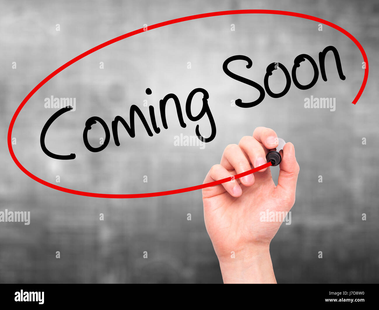 Man Hand writing Coming Soon with black marker on visual screen ...