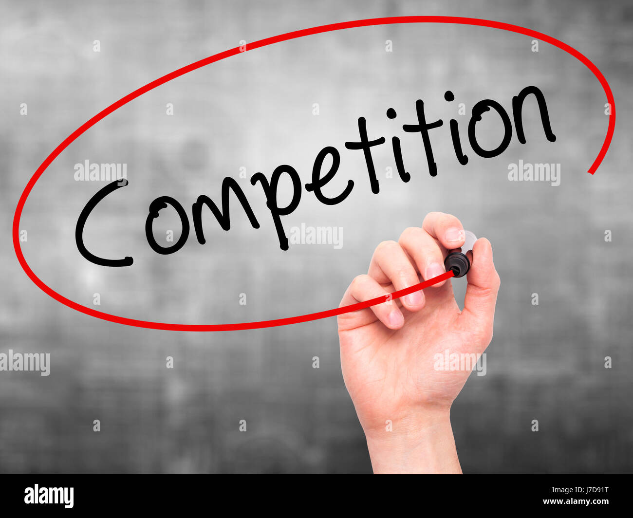 Man Hand writing Competition with black marker on visual screen ...