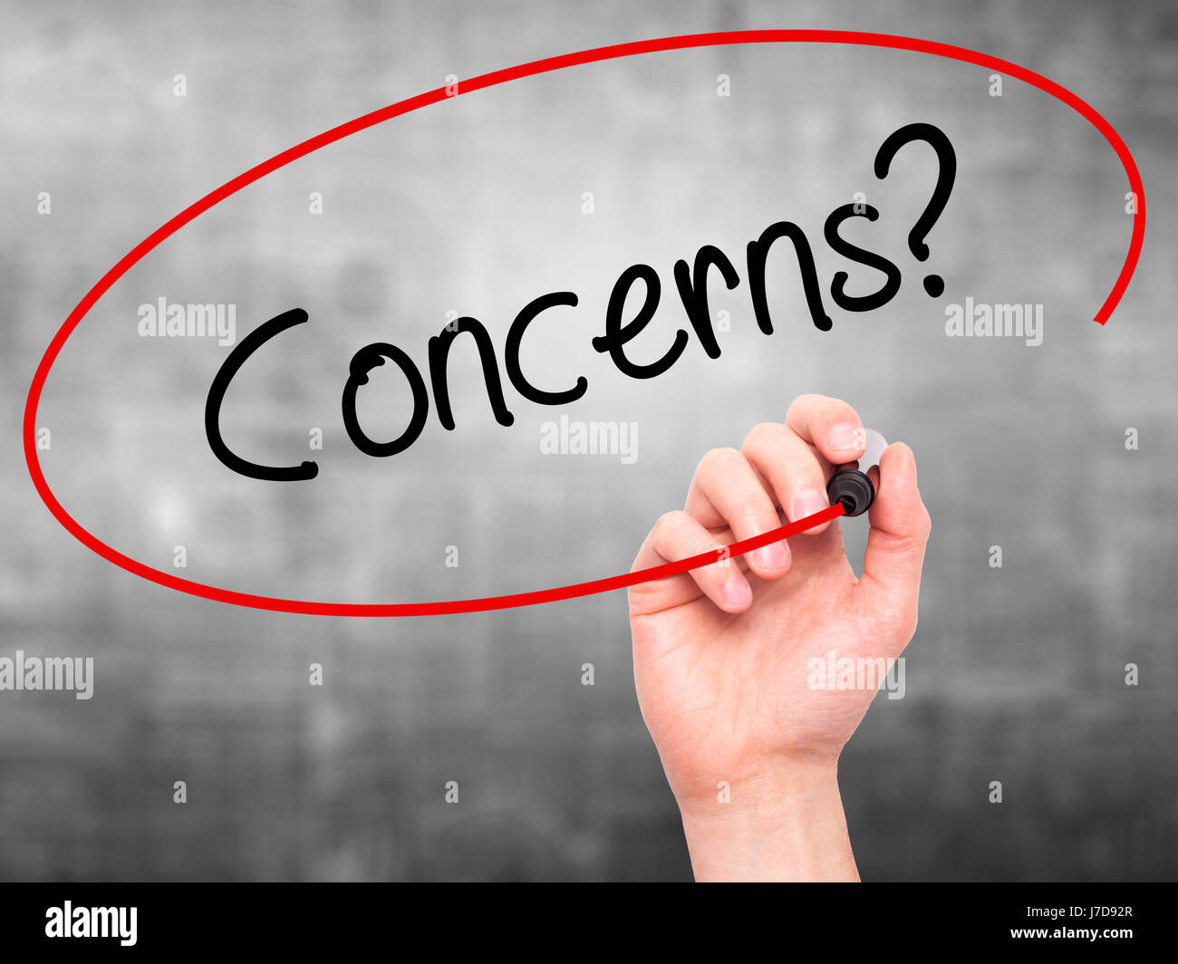 Man Hand writing Concerns? with black marker on visual screen. Isolated ...