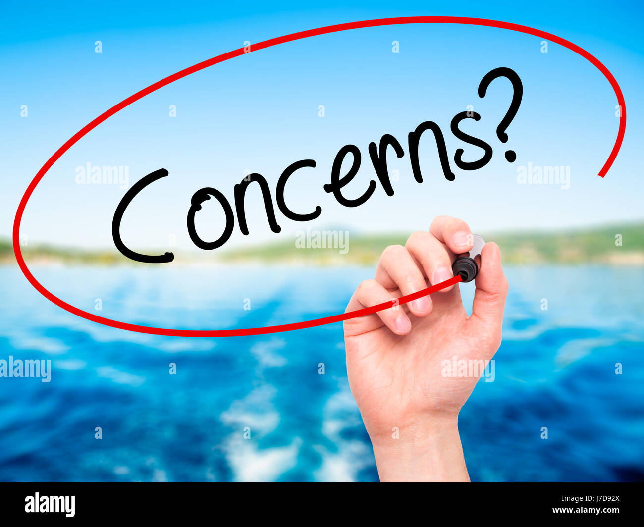 Man Hand writing Concerns? with black marker on visual screen. Isolated ...