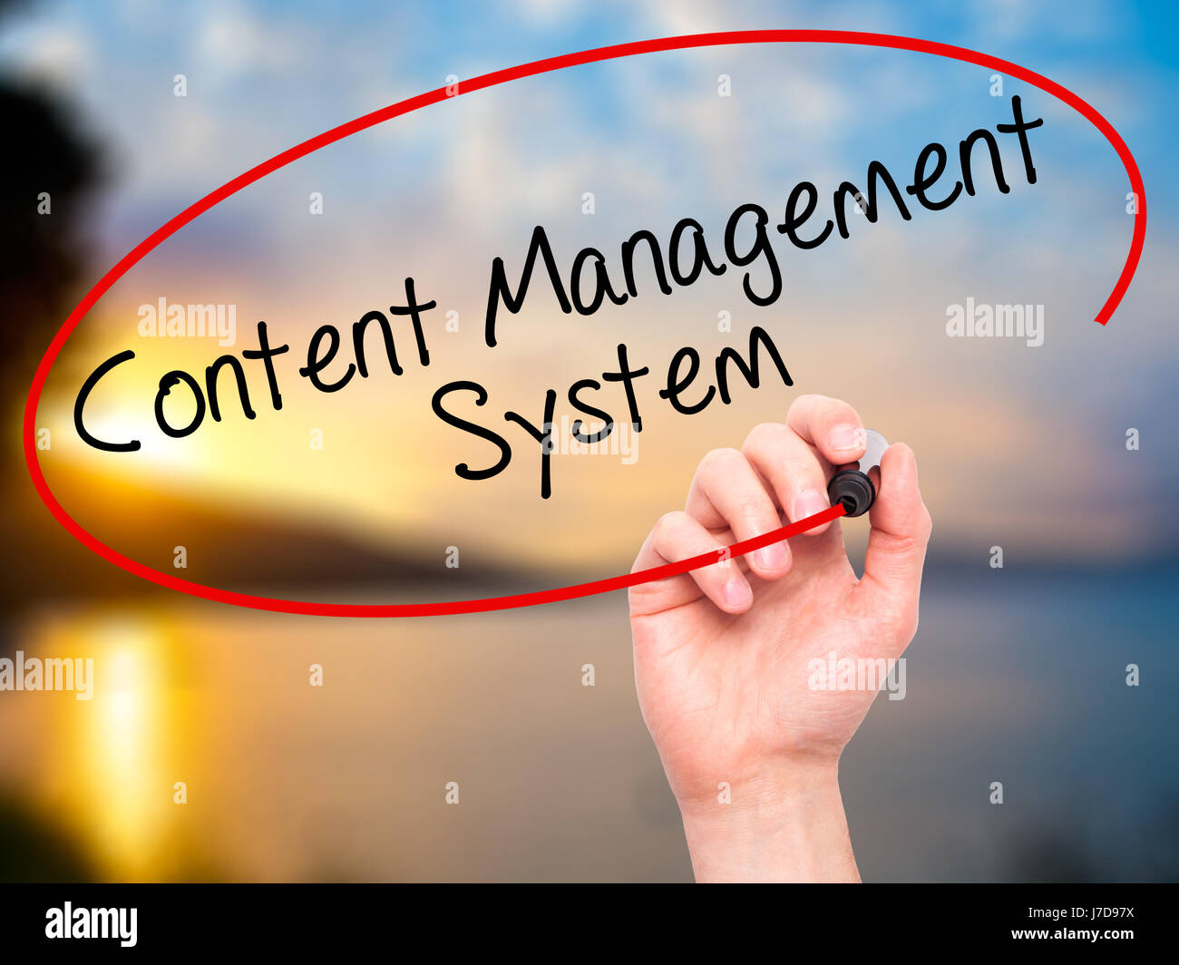 Man Hand writing Content Management System with black marker on visual ...