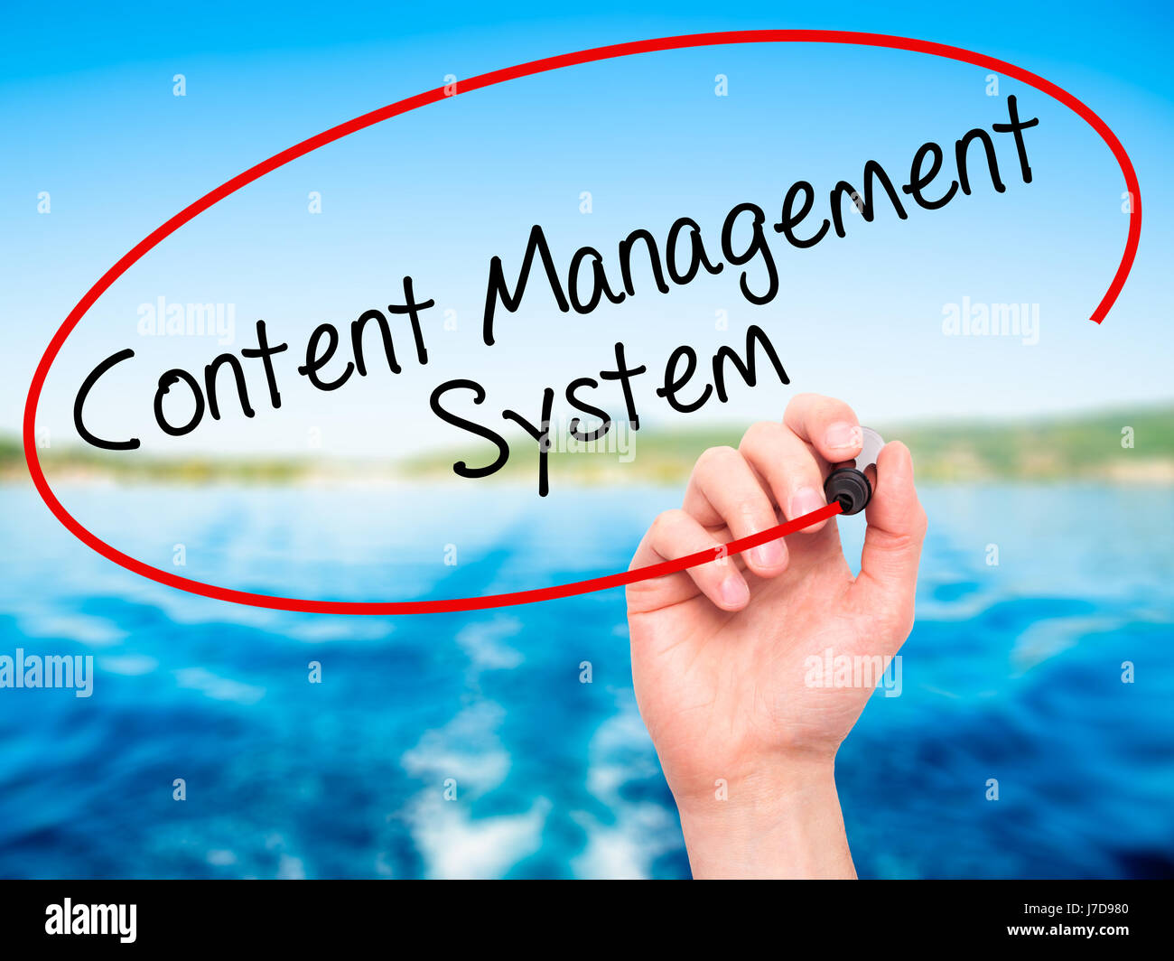 Man Hand writing Content Management System with black marker on visual ...