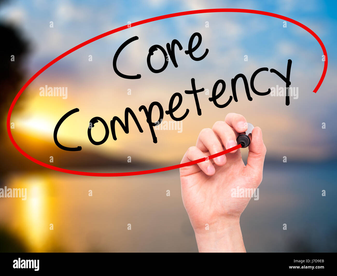 Man Hand writing Core Competency with black marker on visual screen ...