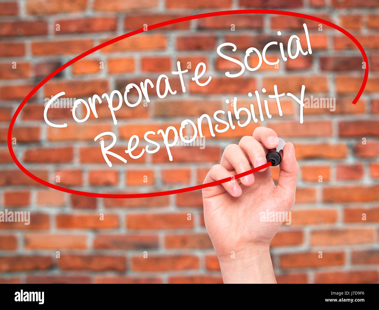 Man Hand writing Corporate Social Responsibility with black marker on ...