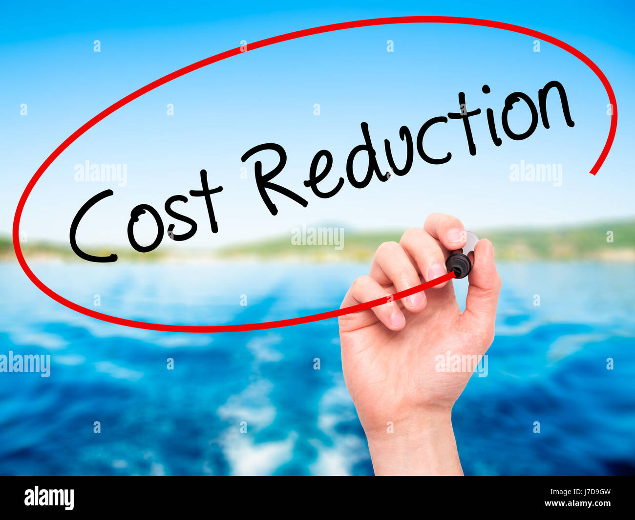Man Hand writing Cost Reduction with black marker on visual screen ...
