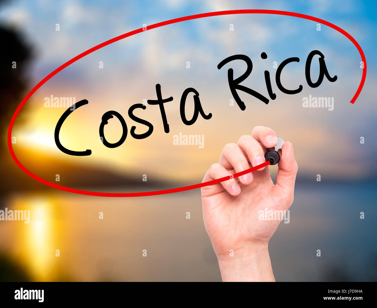 Man Hand writing Costa Rica with black marker on visual screen ...
