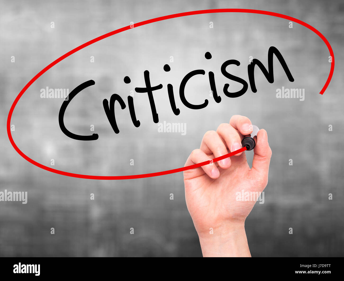 Man Hand writing Criticism with black marker on visual screen. Isolated ...