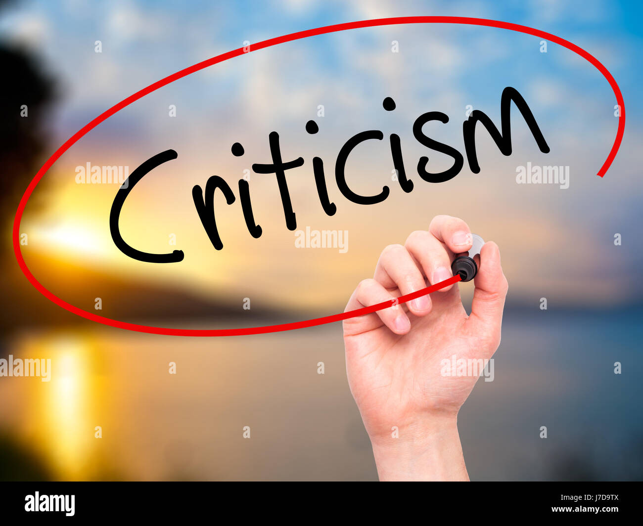 Man Hand writing Criticism with black marker on visual screen. Isolated ...