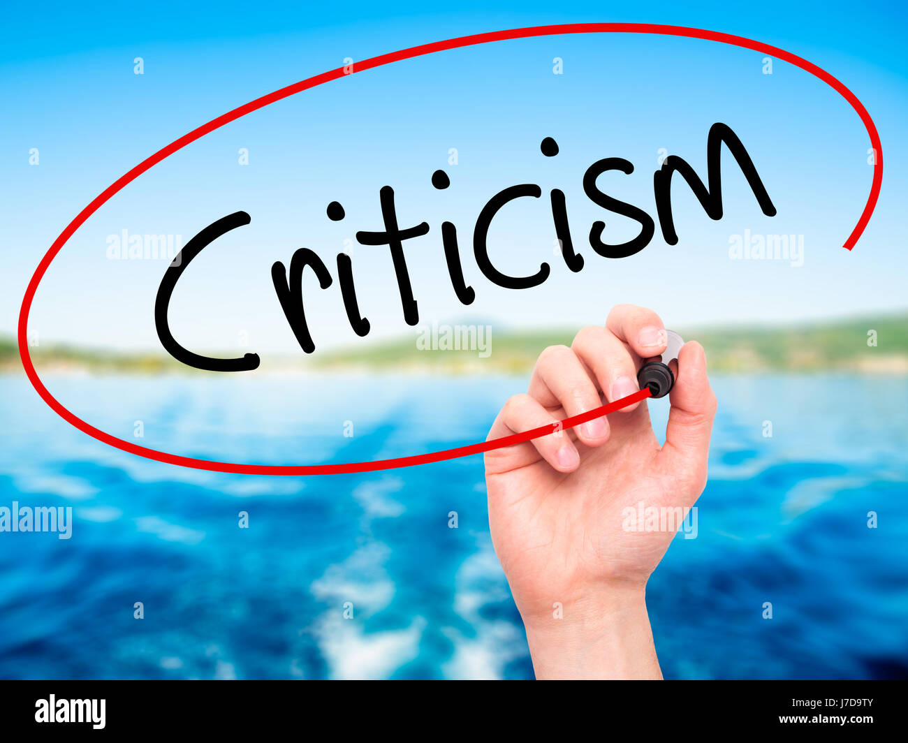 Man Hand writing Criticism with black marker on visual screen. Isolated ...