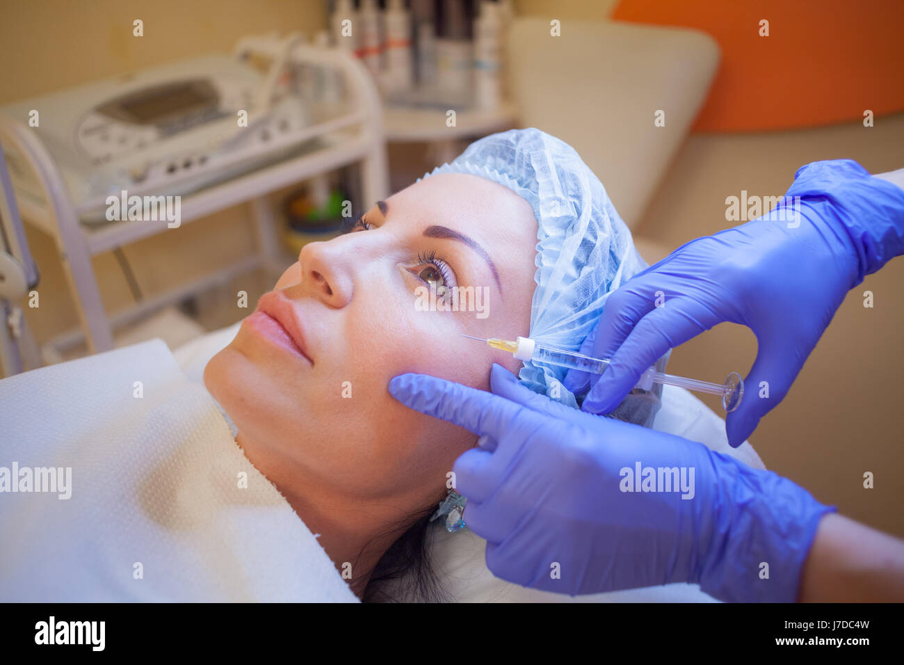 doctor beautician increases lip patient an injection syringe Spa Stock ...