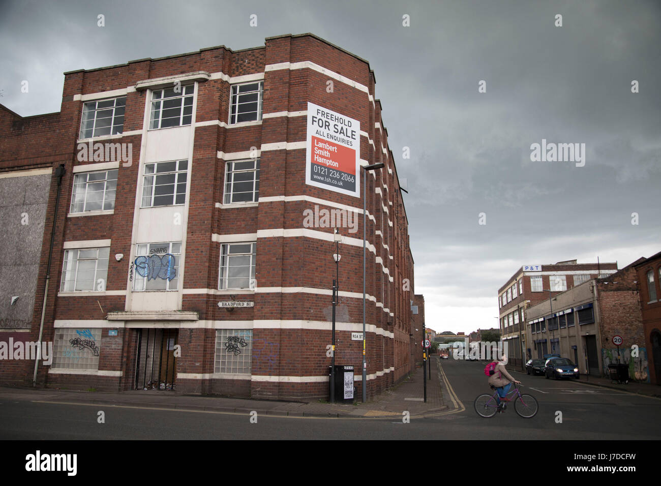 Storm clouds build over old red brick industrial buildings at Digbeth ...