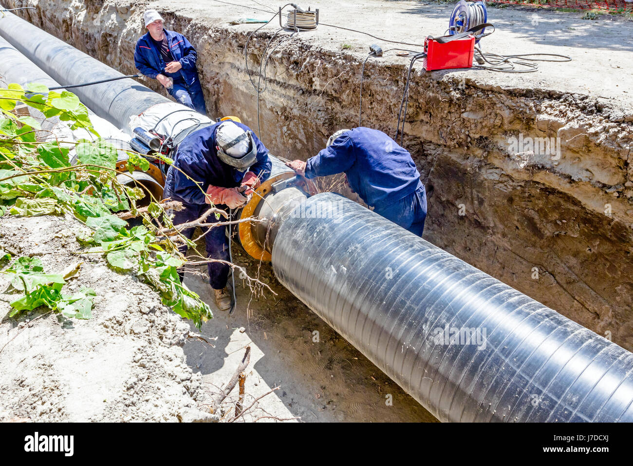 Working with pipes in a building site hi-res stock photography and ...