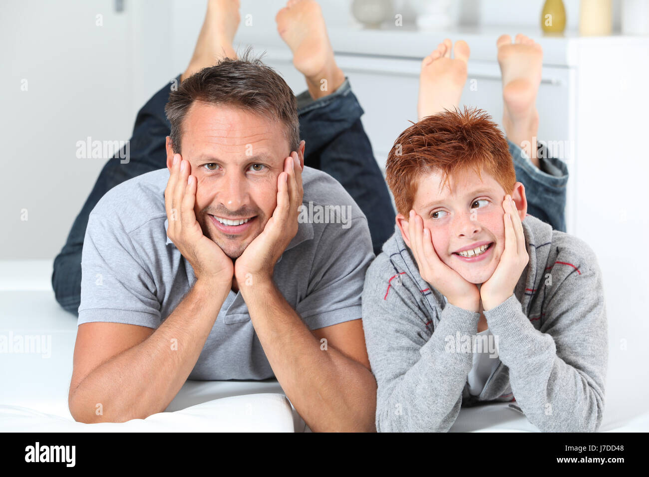 closeup portrait son blank european caucasian lie lying lies sofa ...