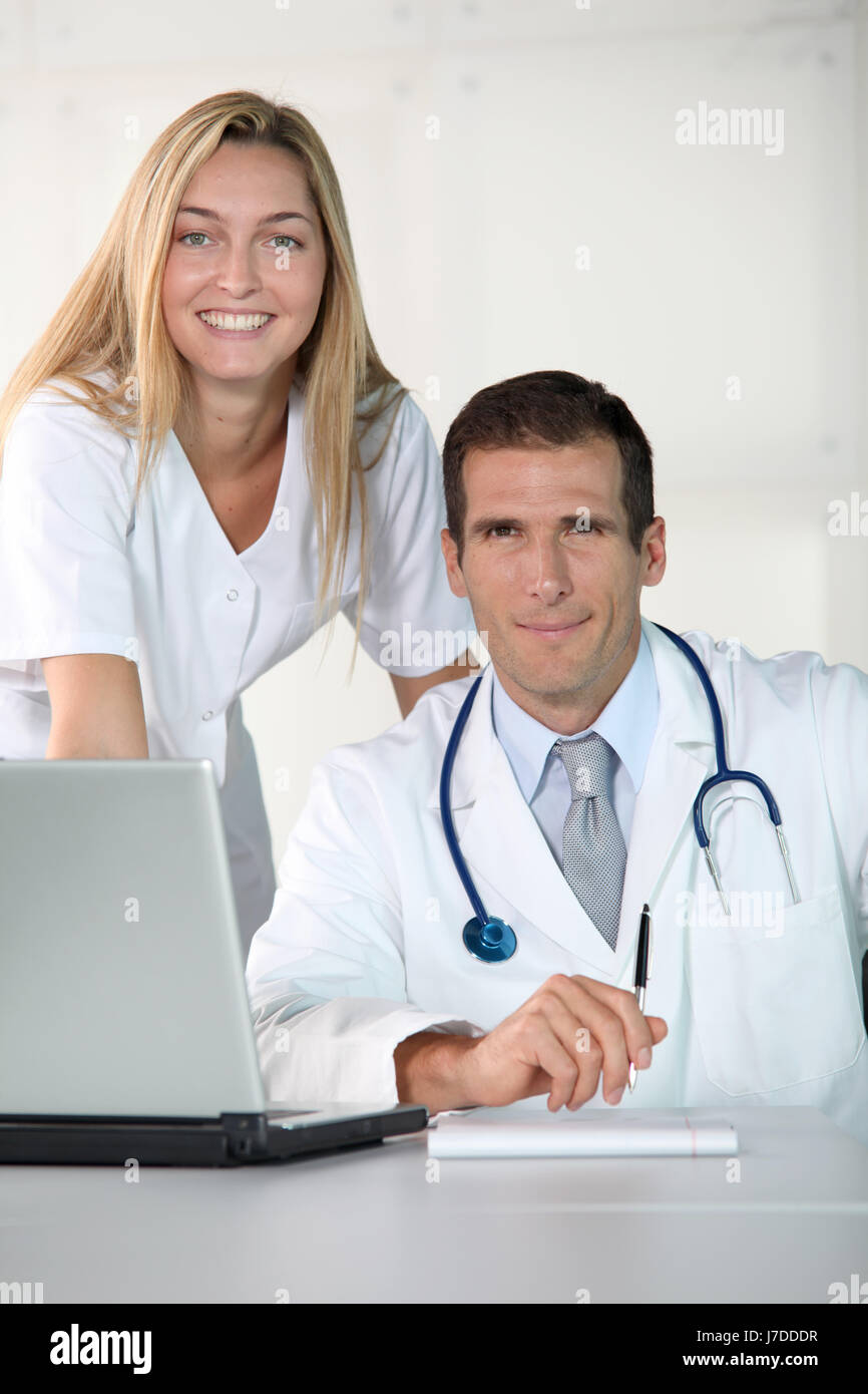 doctor physician medic medical practicioner woman office laugh laughs ...