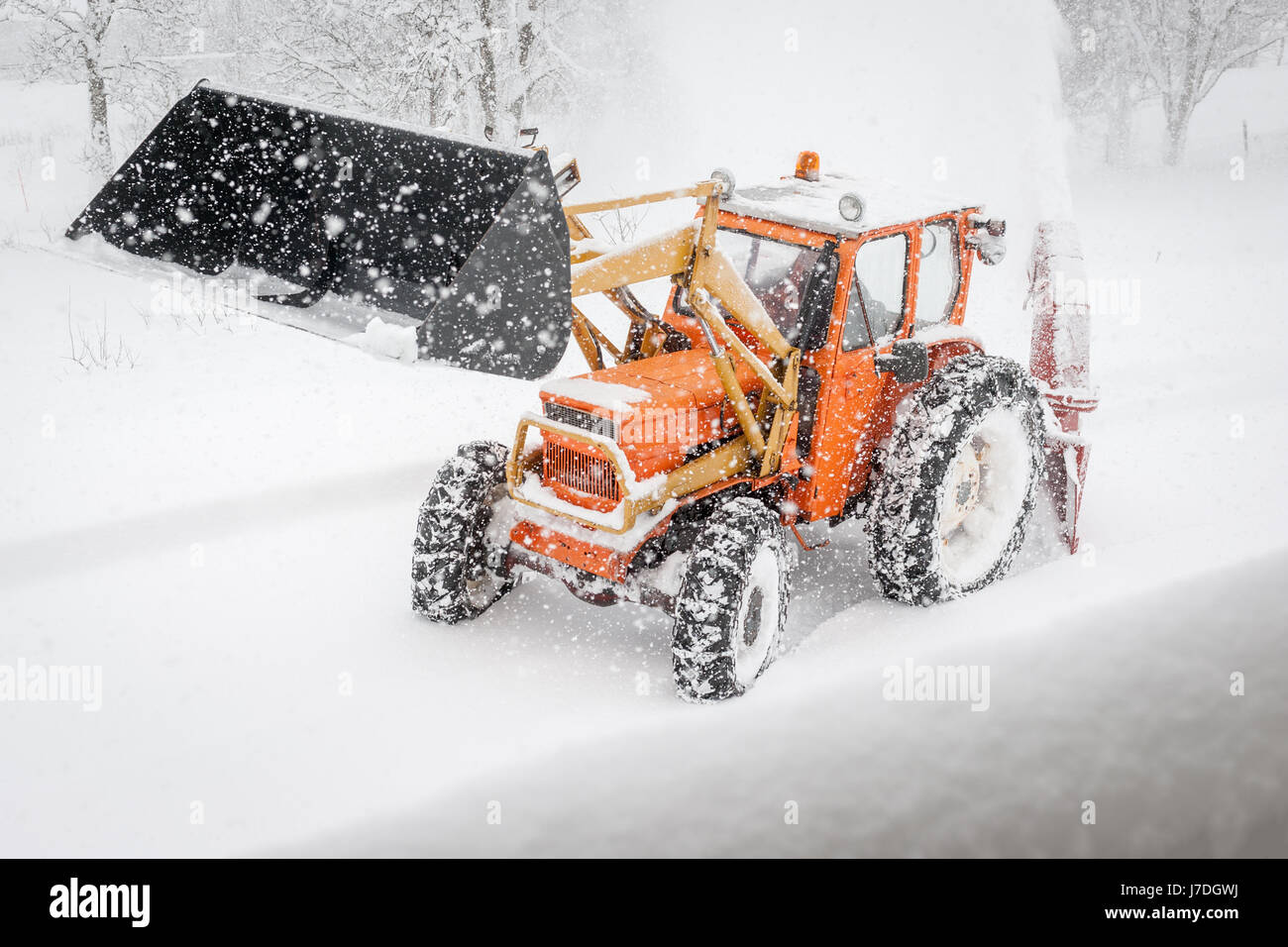 Tractor clearing snow Stock Photo - Alamy