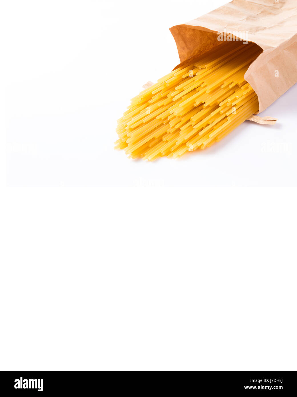 raw, uncooked, spaghetti noodle spilling out of brown paper bag, white ...
