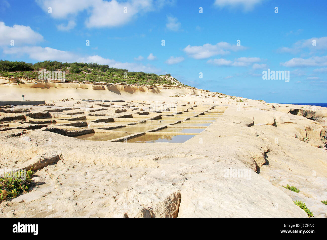 salt extraction in gozo Stock Photo - Alamy