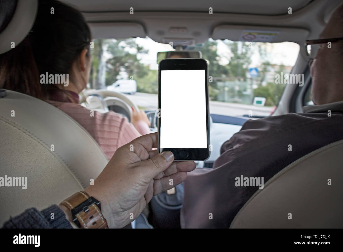 Mobile phone with GPS to give the girl directions to drive Stock Photo ...