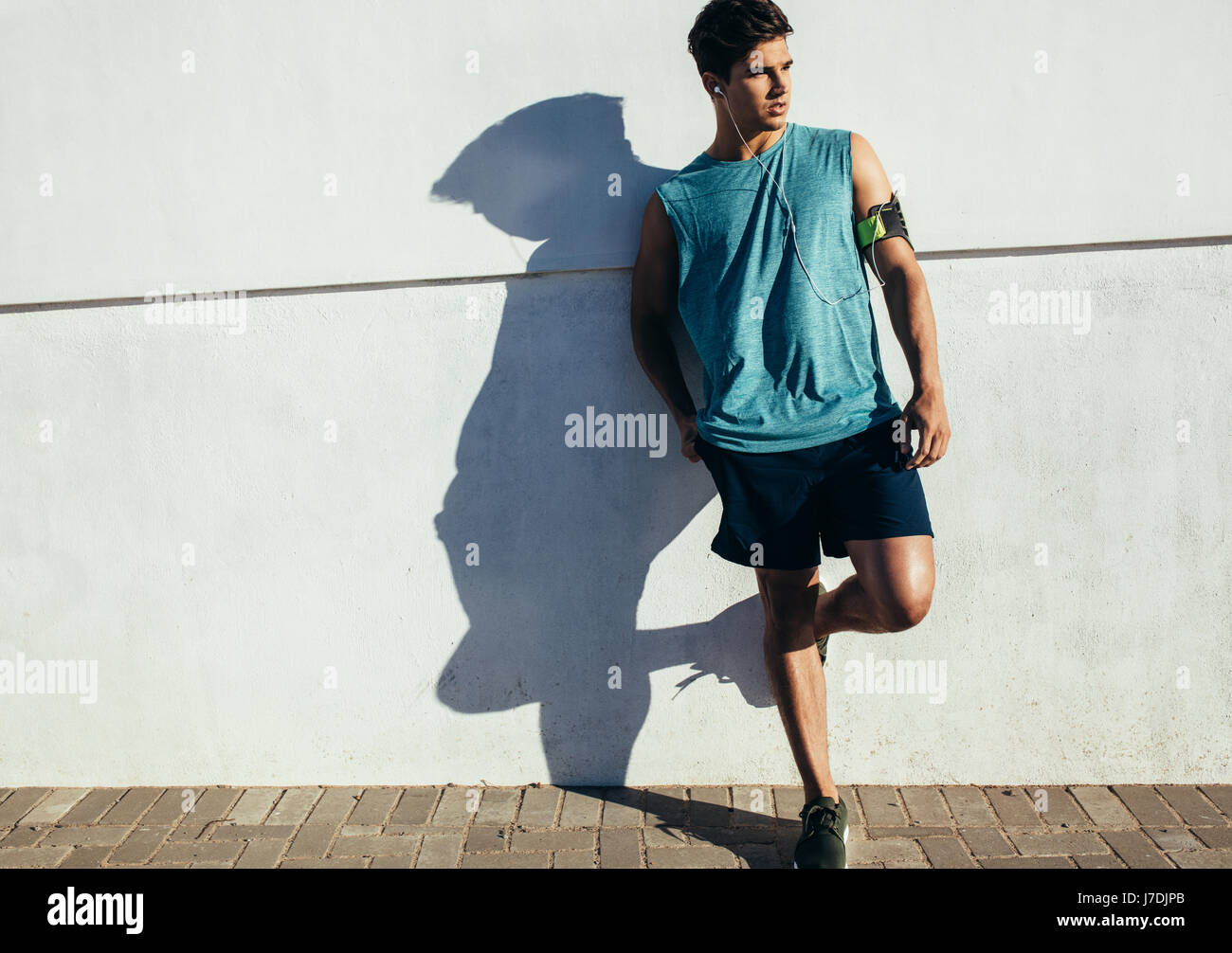 Fitness wall leaning man hi-res stock photography and images - Alamy
