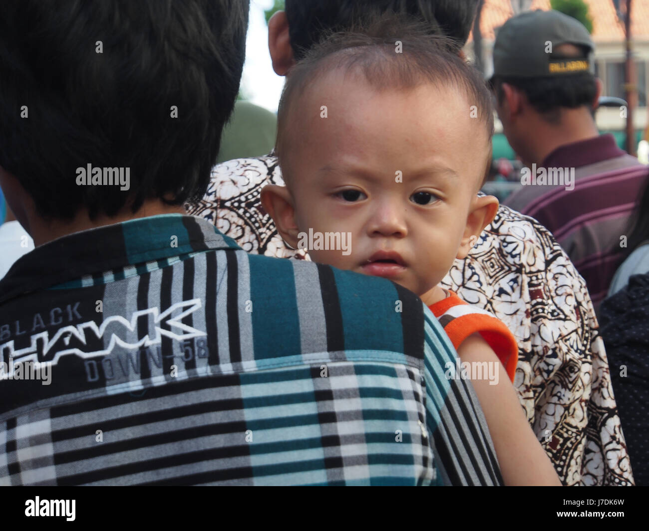 Jakarta, Indonesia - January 11, 2015: Small Indonesian child, with ...