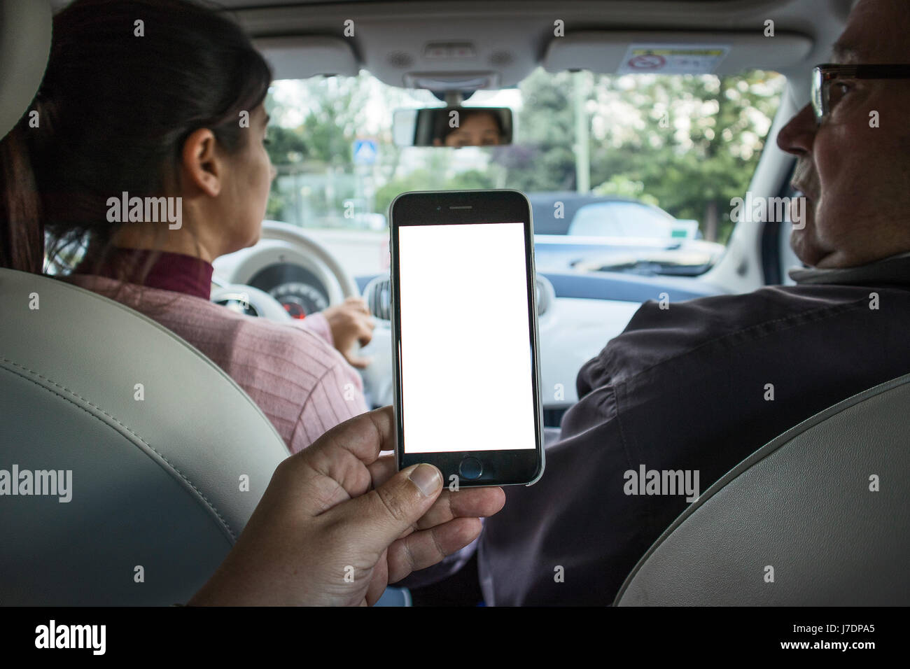 Girl driving with GPS instructions on the phone Stock Photo - Alamy