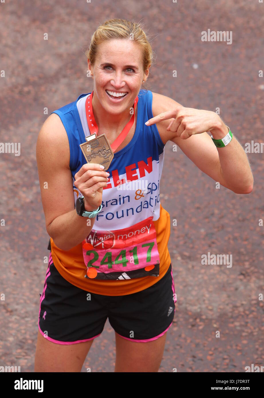 British professional rower, Helen Glover holds up her medal at the ...