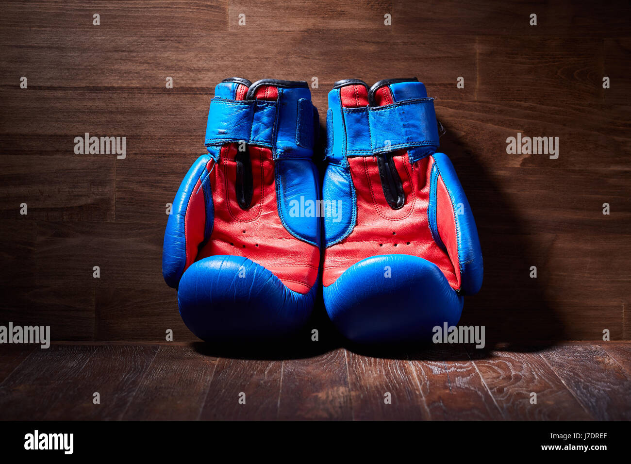 Boxing background with two gloves on the brown plank background ...