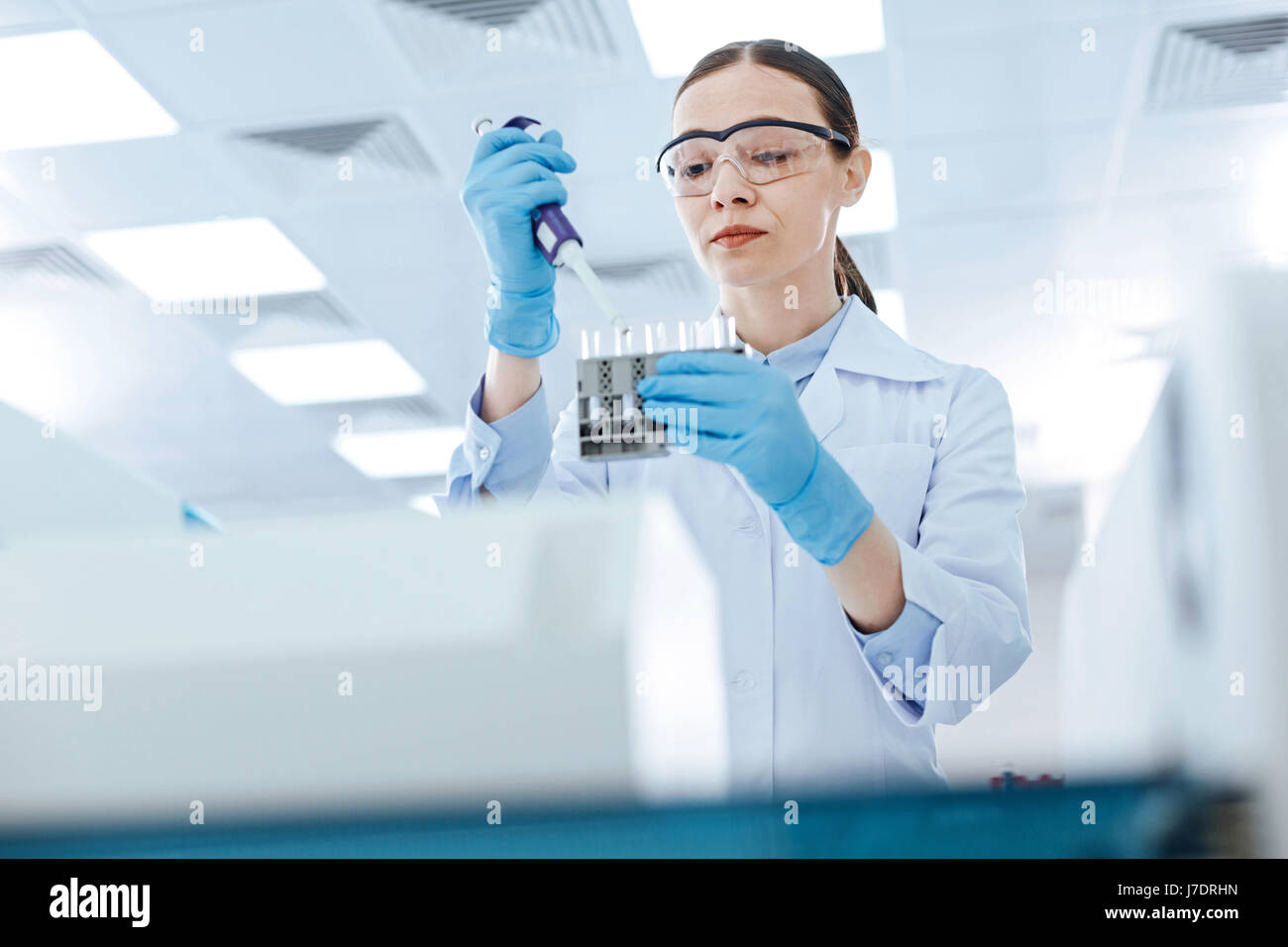 Woman doing blood analysis hi-res stock photography and images - Alamy